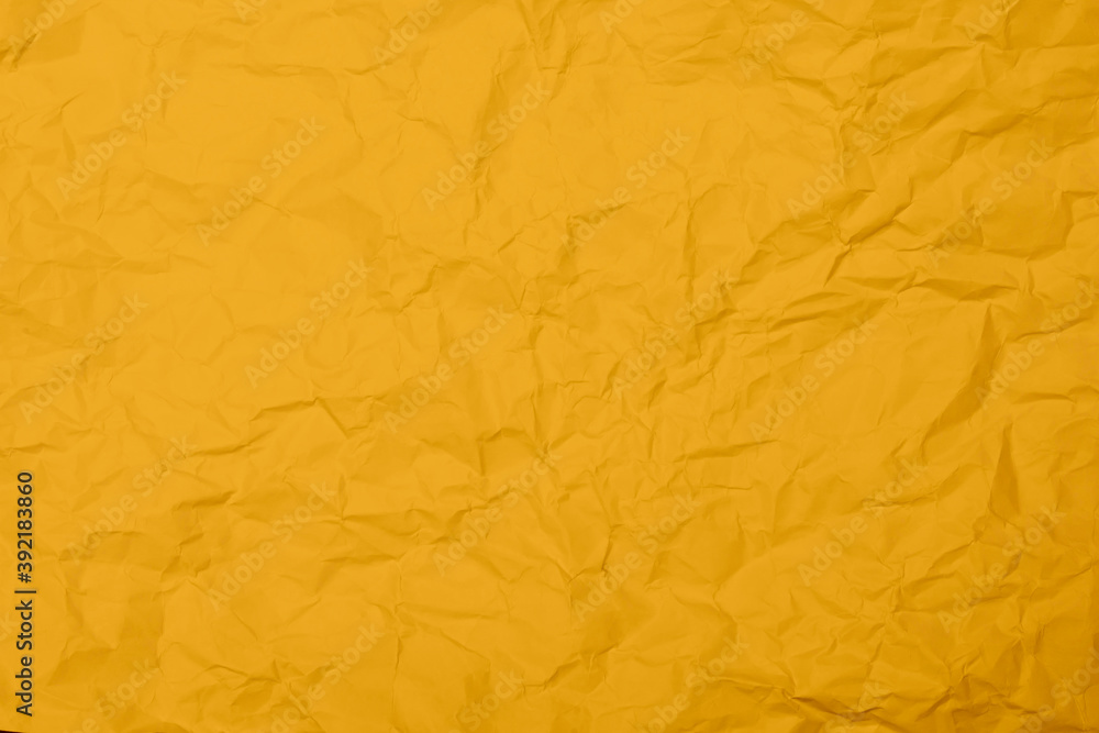 Closeup yellow crumpled paper texture background. Yellow wrinkled paper texture background ...