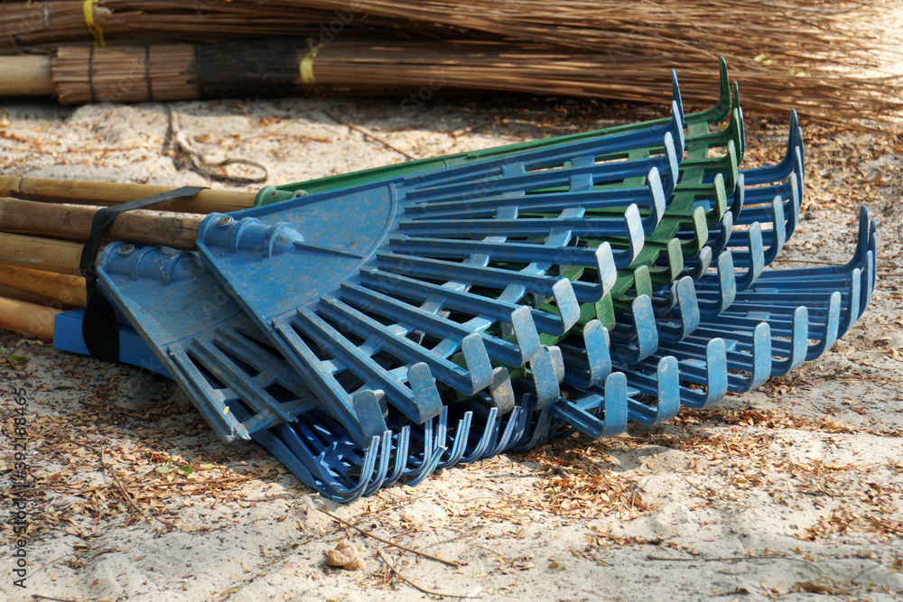 Sweeping rake and Broom grass put on the ground preparing for cleaning ...