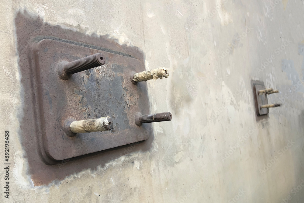 Embedded anchor block with anchor bolts mantled in concrete vertical ...