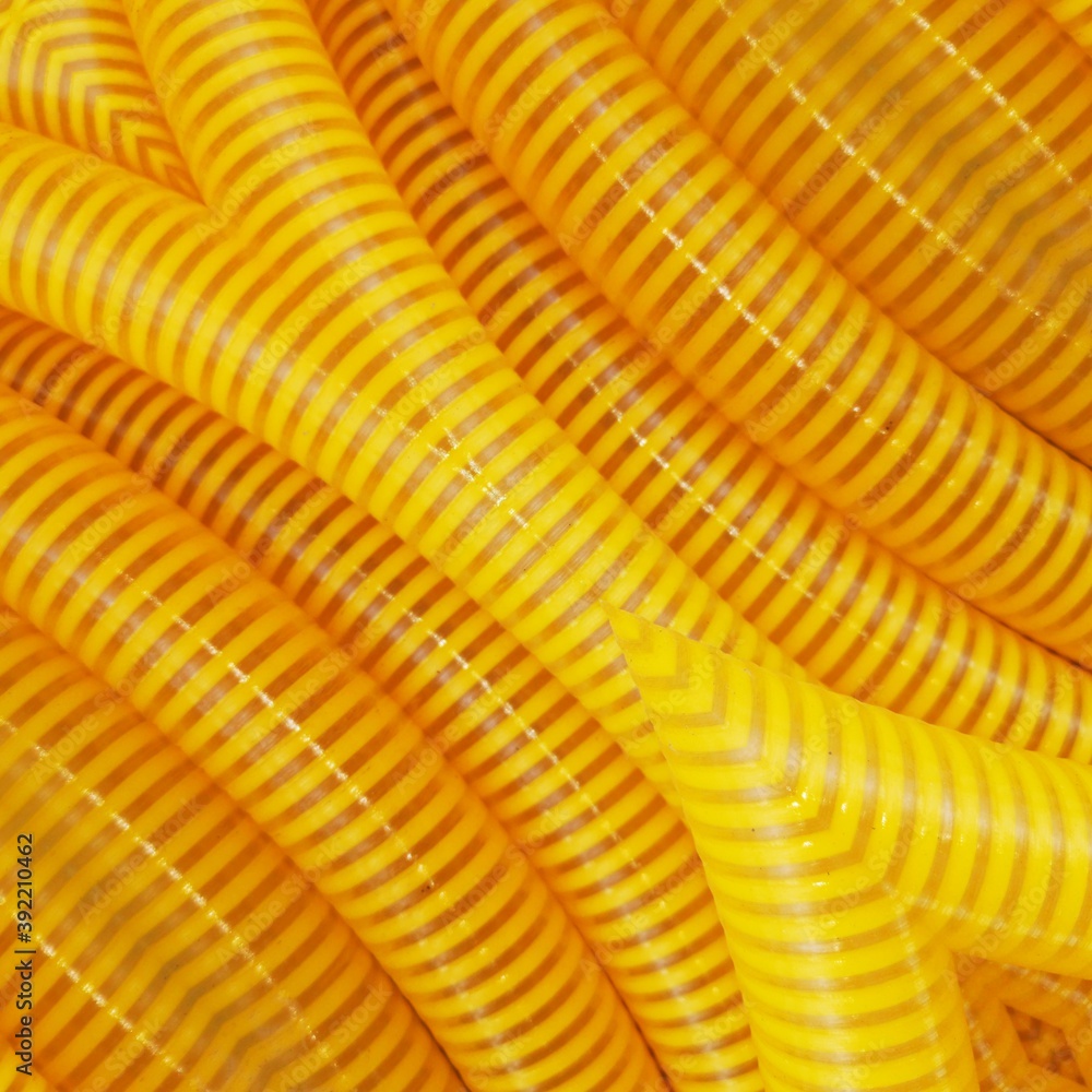 patterns and design by reflection of vivid yellow coloured industrial ...