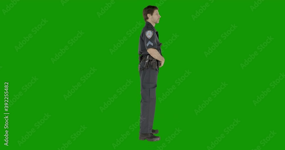CHROMA KEY Caucasian male police officer standing against green screen ...
