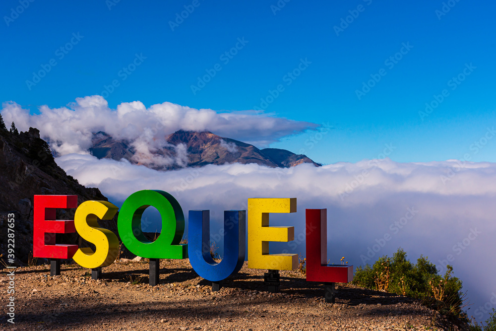 Esquel sign lookout point against Andes mountains and clouds in ...