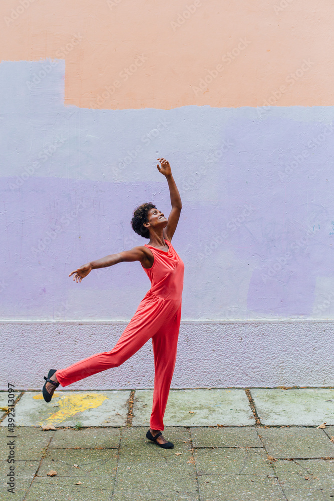 Girl dancing around in street Stock Photo | Adobe Stock