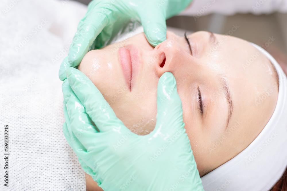 Beautiful girl gets face peeling. Skin health concept. Beauty salons ...