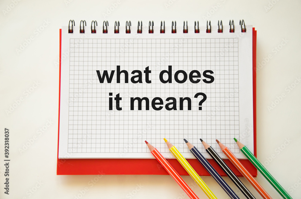 text what does it mean written on notepad with pencils and white ...