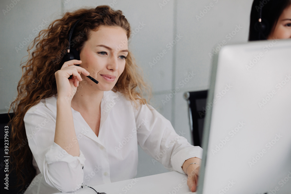 Call center worker accompanied by her team. Asian woman working in call ...