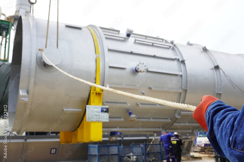 Worker during rope access rigger commencing high risk job to holding a ...