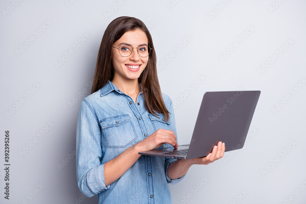 Photo of cute pretty woman stand typing laptop wear spectacles blue ...