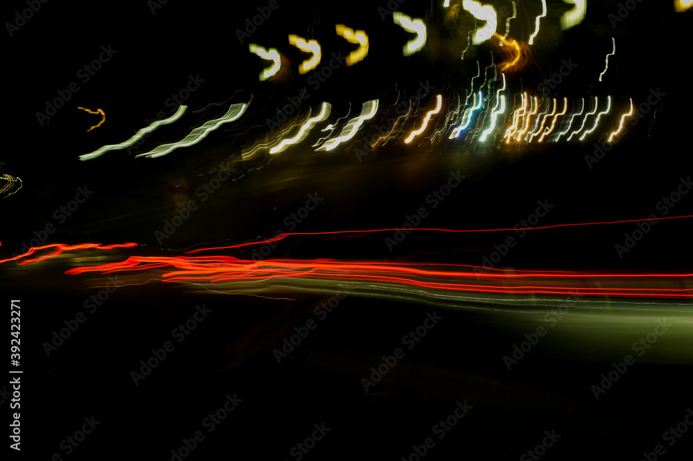 Bright orange neon glowing fast moving streams of light, along a ...