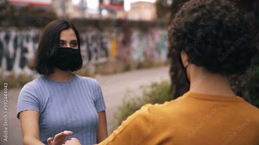 concept of social distance - young couple approach hands without touch ...