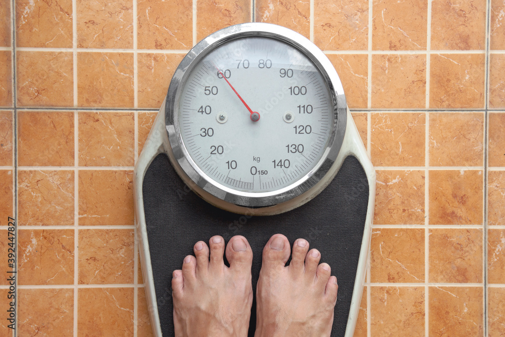 Top view of Weight scale, Man foot step on the weight scale Stock Photo ...