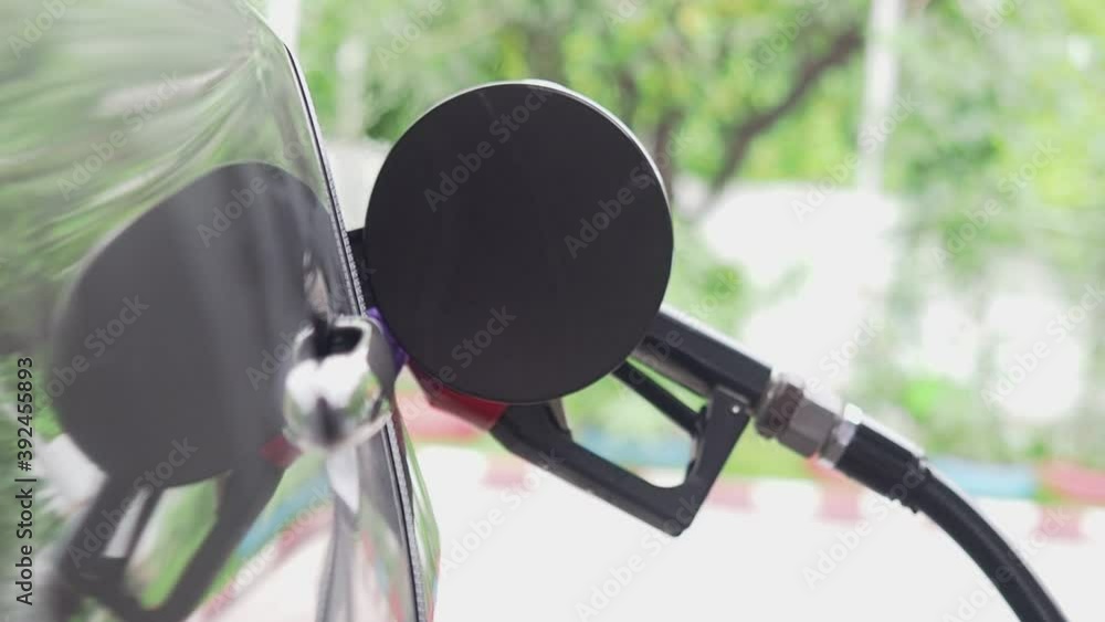 gas vapor come out from fuel tank when refueling at petrol station ...