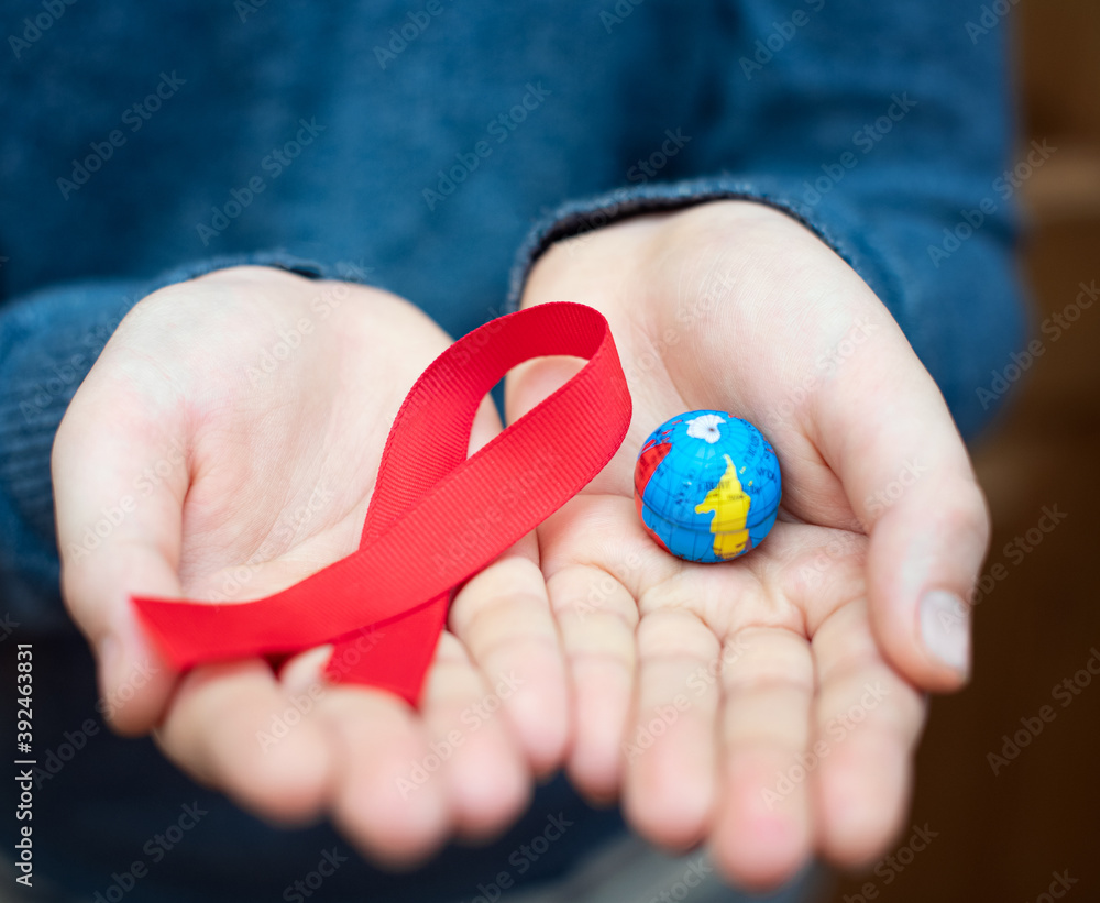World day of fight against AIDS. The symbols are a red ribbon and an ...