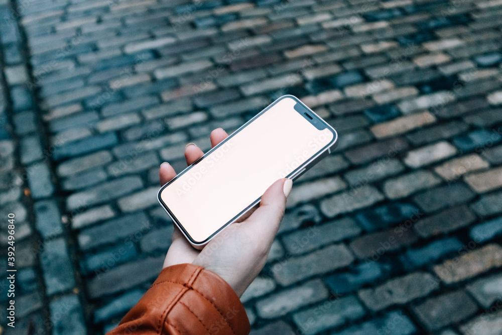Holding iPhone 12 Mini on Cobblestone Street UI Mock Up - Single Hand ...