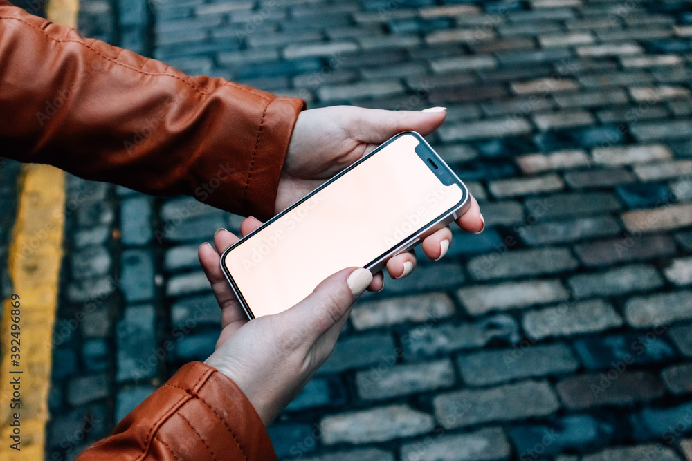 Holding iPhone 12 Mini on Cobblestone Street UI Mock Up - Two Hands ...