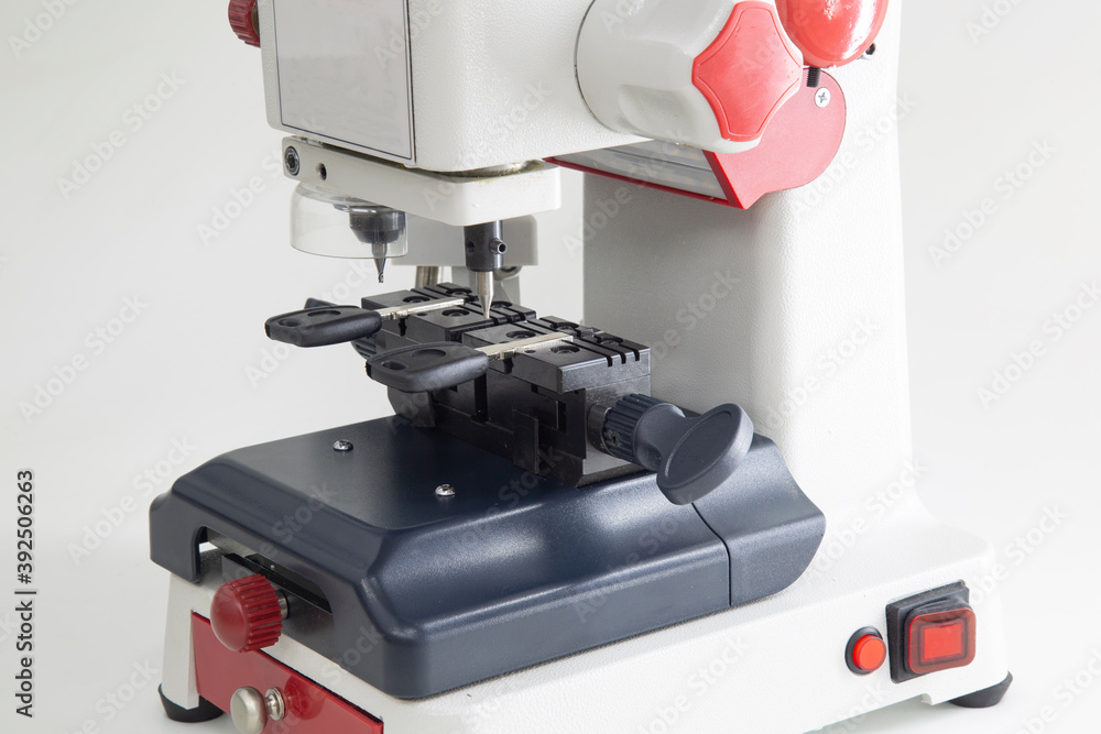 Production of car keys on a specialized key machine. Stock Photo ...