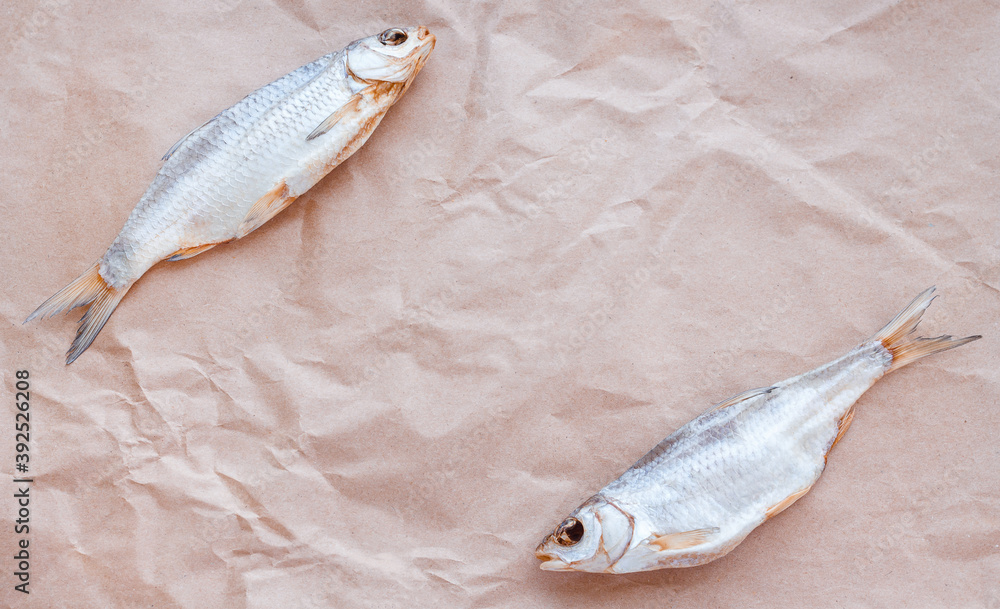 Dried fishes flat lay template banner on craft paper background with ...