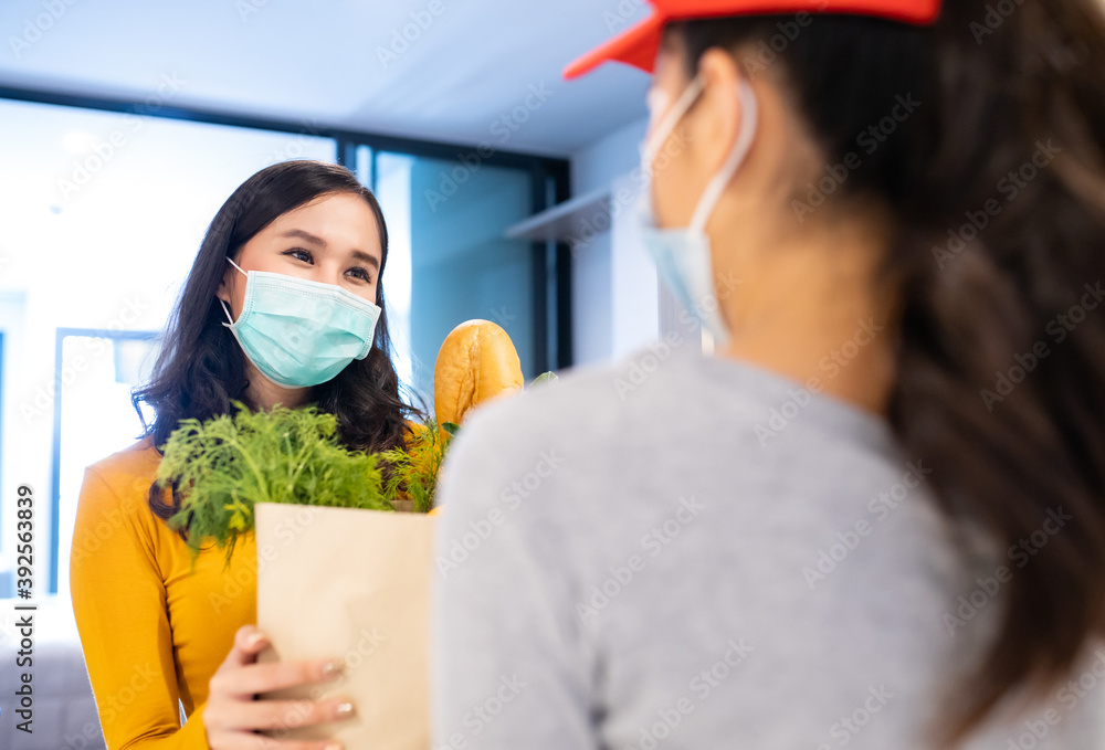 Asian woman face mask at home and deliver woman wearing face mask ...