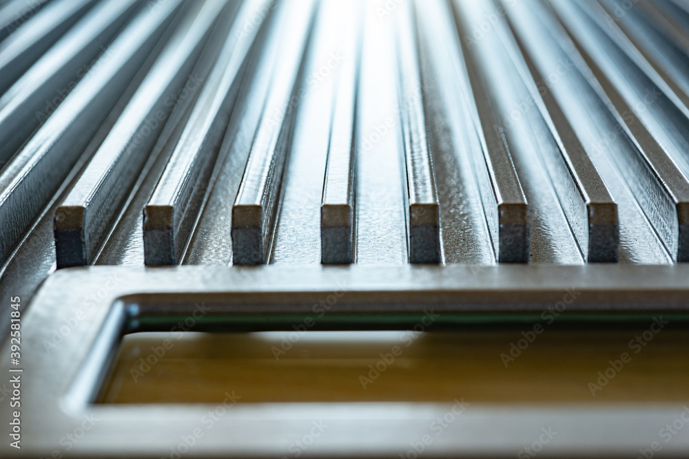 Fluted metal surface next to a control panel Stock Photo | Adobe Stock