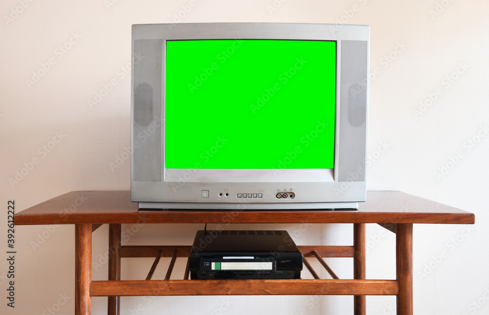 Old silver vintage TV with clutter from 1980s, 1990s, 2000s, VCR on ...