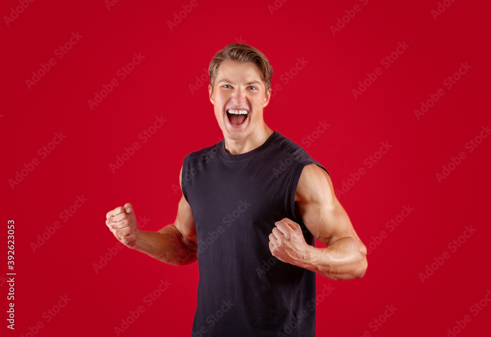 Emotional Caucasian sportsman screaming, making YES gesture ...
