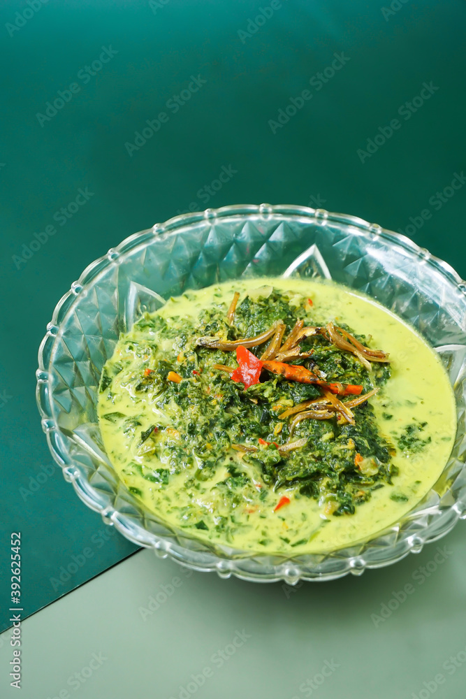 Sayur Ubi tumbuk / Mandailing crushed cassava leaves curry as ...