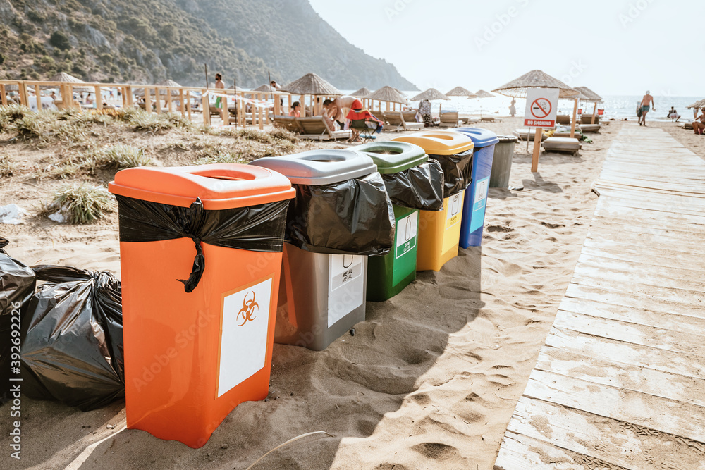 Separate Collection Of Garbage And Waste On A Public Beach As An separate-collection-of-garbage-and-waste-on-a-public-beach-as-an
