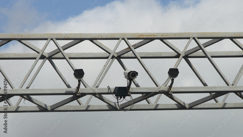 Speedcams on sky background, CCTV cameras on large mast, city safety ...