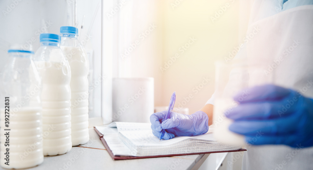 Food expert records test results and laboratory analysis of milk ...