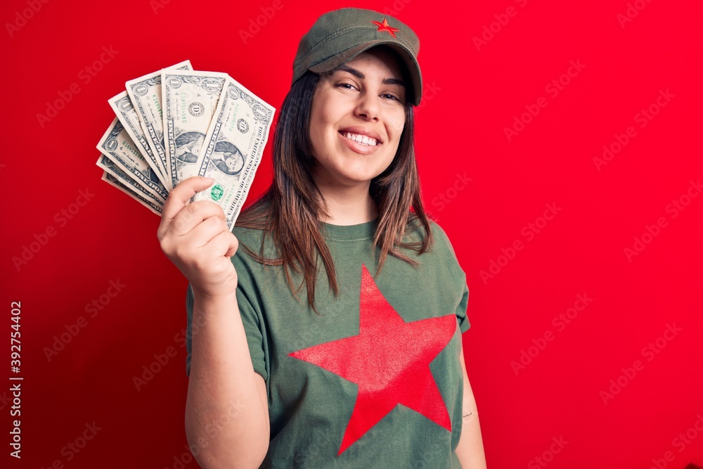 Woman wearing t-shirt with red star communist symbol holding bunch of ...