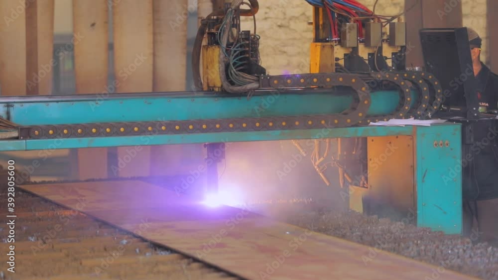 Cutting a metal sheet with a CNC cutting machine. Cnc cutting a metal ...