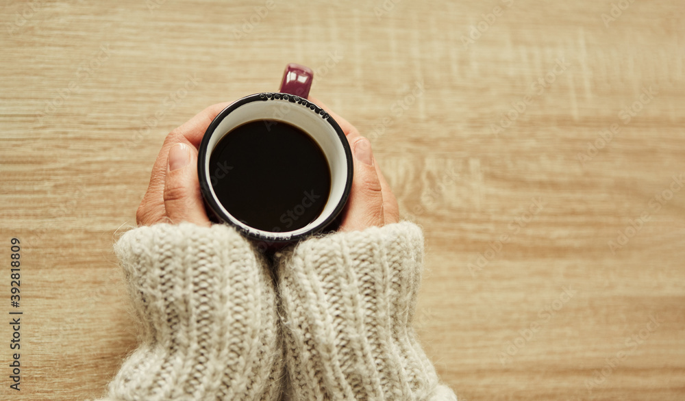 Hands warm up on a cup of coffee Stock Photo | Adobe Stock