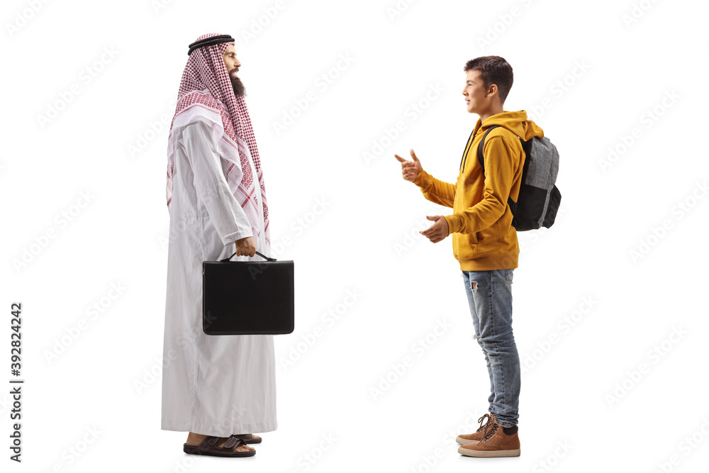 Full length profile shot of a saudi arab man in a thobe and a teenage ...