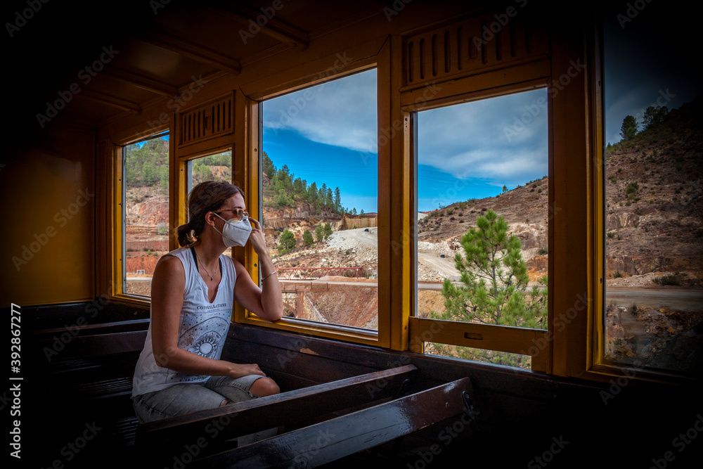 young girl looking longingly out the window of a train Stock Photo ...
