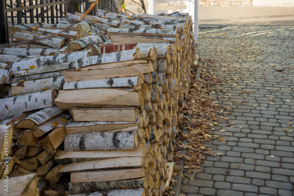 Pile firewood prepared for fireplace. Kiln dried wood for fire. Birch ...