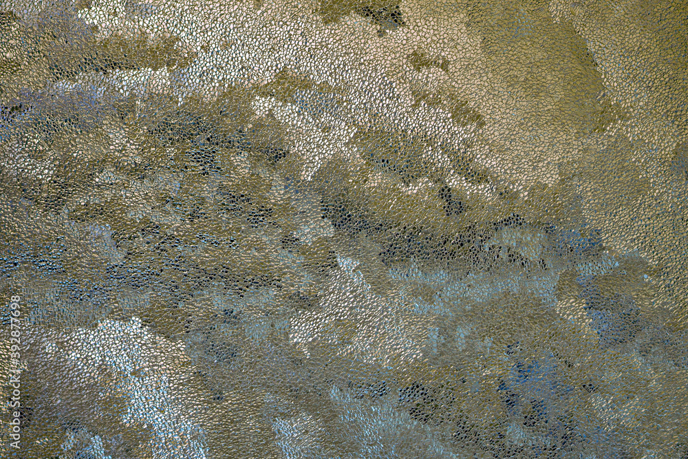 Abstract grainy background in dark olive and blue colors. Surface of ...