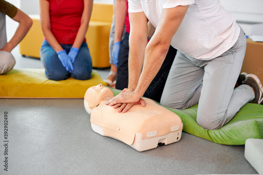 caucasian people practice an exercise of resuscitation during lesson ...