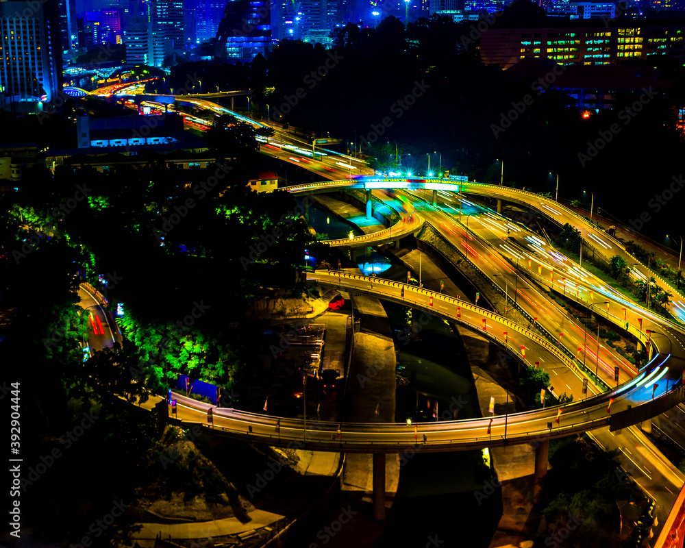 Car light trails on highway and overpass in city. Night traffic on city ...