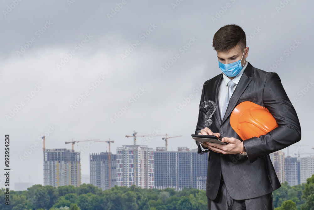 Civil engineer shows a question mark on a tablet . Stock Photo | Adobe ...