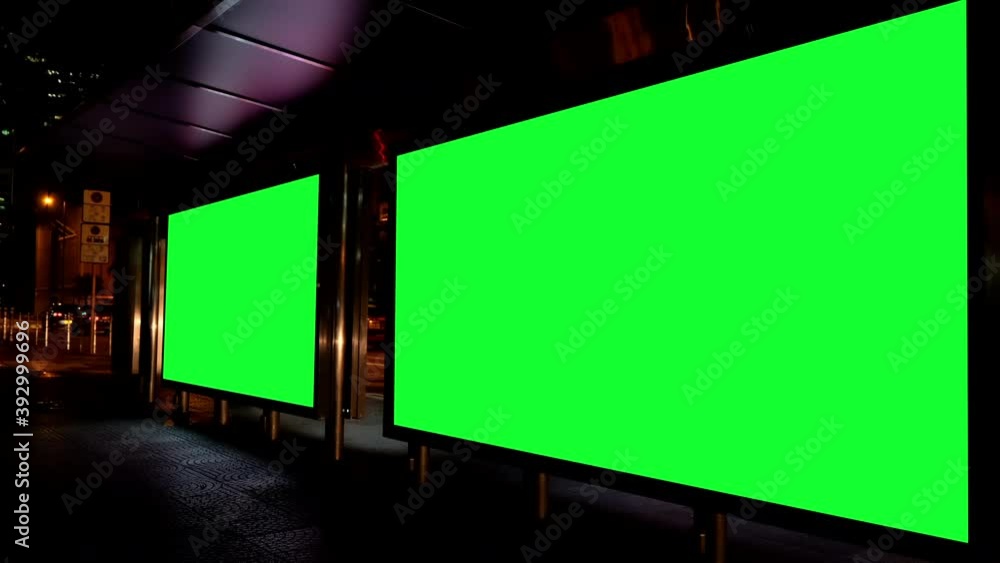 Night city street billboard stand with green screen. Green screen for ...