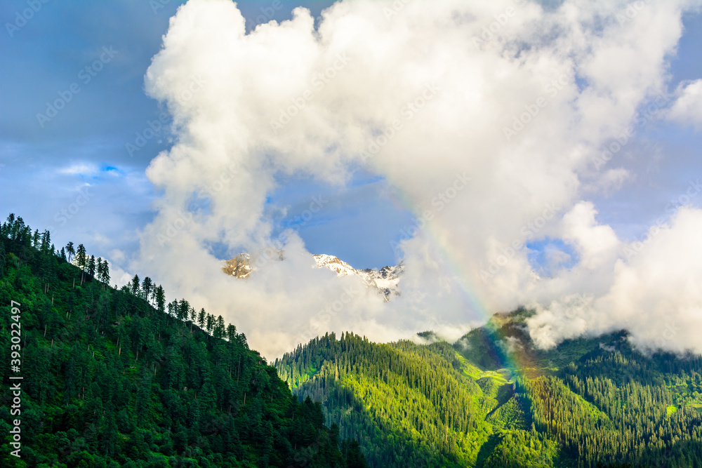 Clouds and Rainbow over the Himalayan mountain in Himachal Pradesh ...