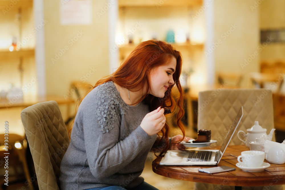 Caucasian beautiful plus size lady overweight woman eating a chocolate ...