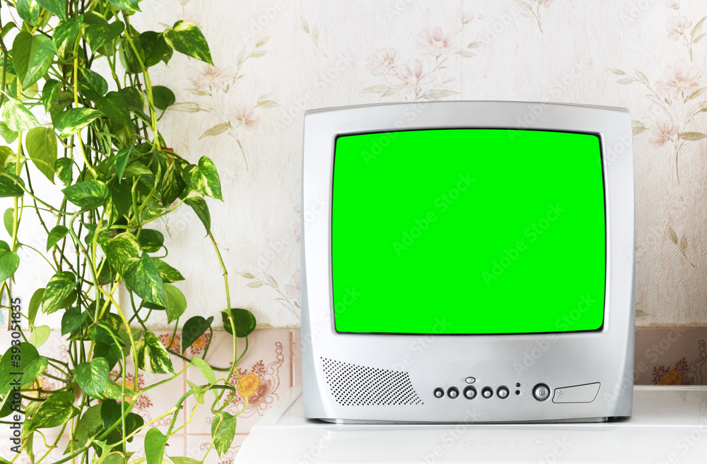 Foto de Retro TV in a green screen room with vintage wallpaper in the ...