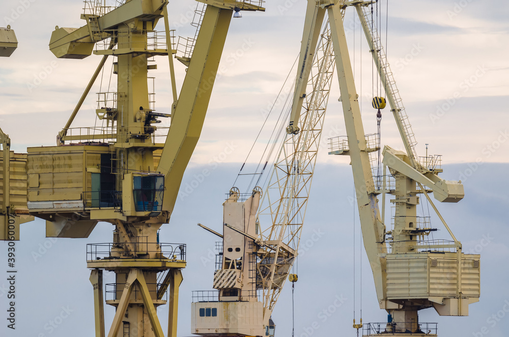 PORT AND SHIPYARD CRANES - Tools for work in a seaport Stock Photo ...