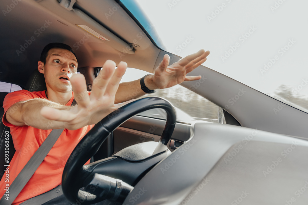 Fear of young man driving car at high speed. Accident on road. Shock ...