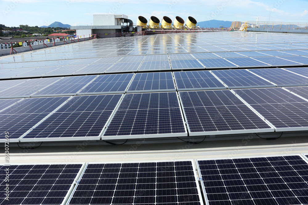 Solar PV System on Industry Roof with Cooling Towers Background Stock ...