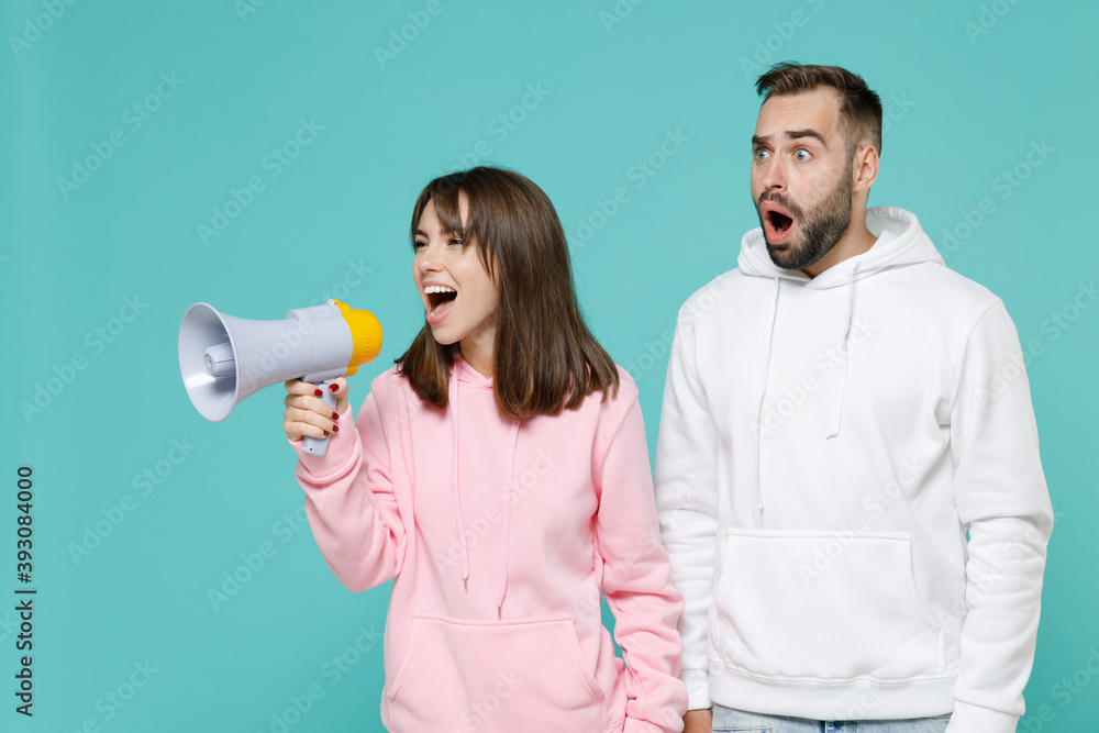 Shocked amazed young couple two friends man woman 20s wearing white ...