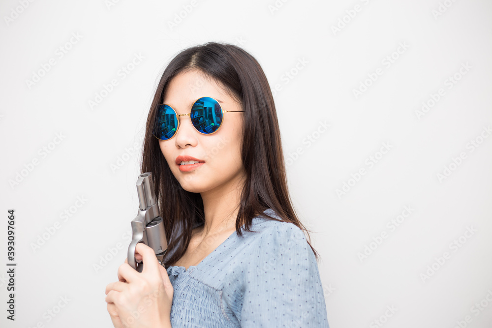 Beautiful asian women hold .44 magnum revolver gun on white background ...