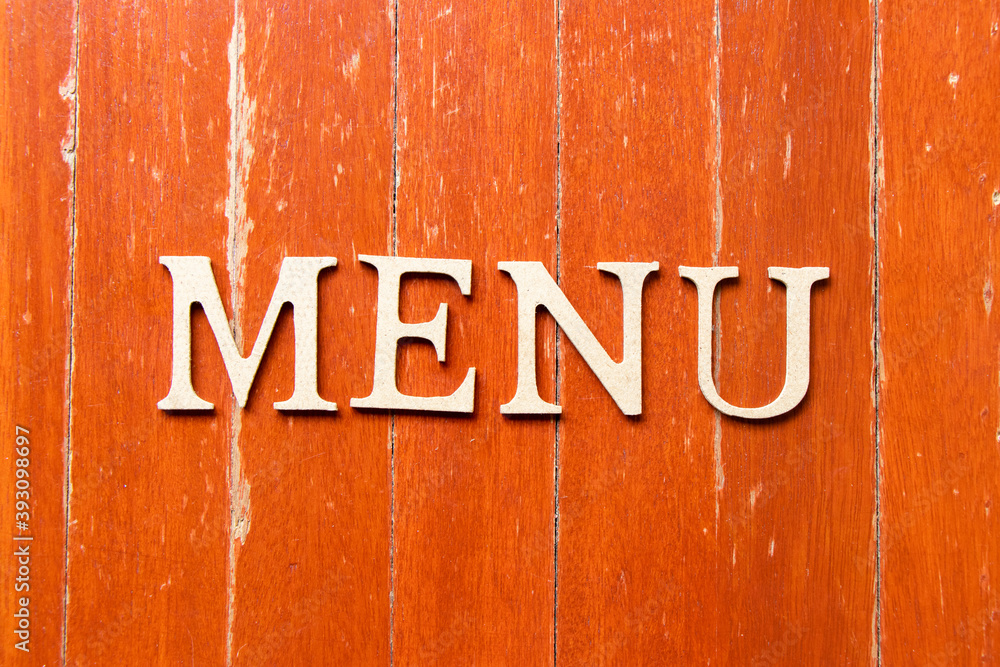 Alphabet letter in word menu on old red color wood plate background ...