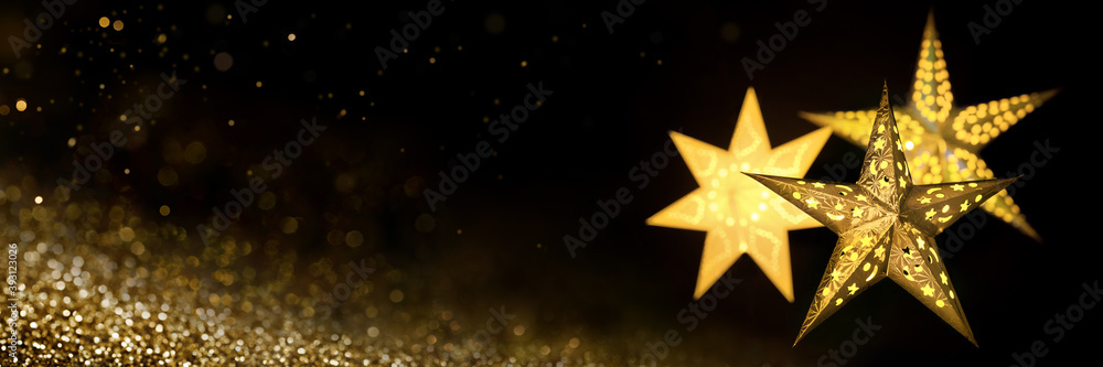 Ornate gold star lanterns for Christmas on black background with golden ...